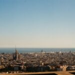 Panoramic view of Barcelona skyline with the Sagrada Familia and the Mediterranean Sea in the background
