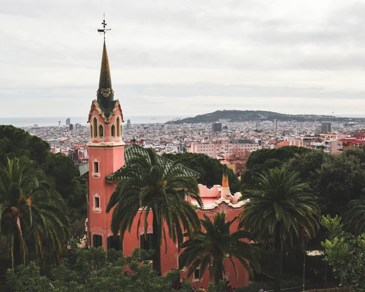 Colorful spire of the Gaudi House Museum at Park Guell with Barcelona city in the background