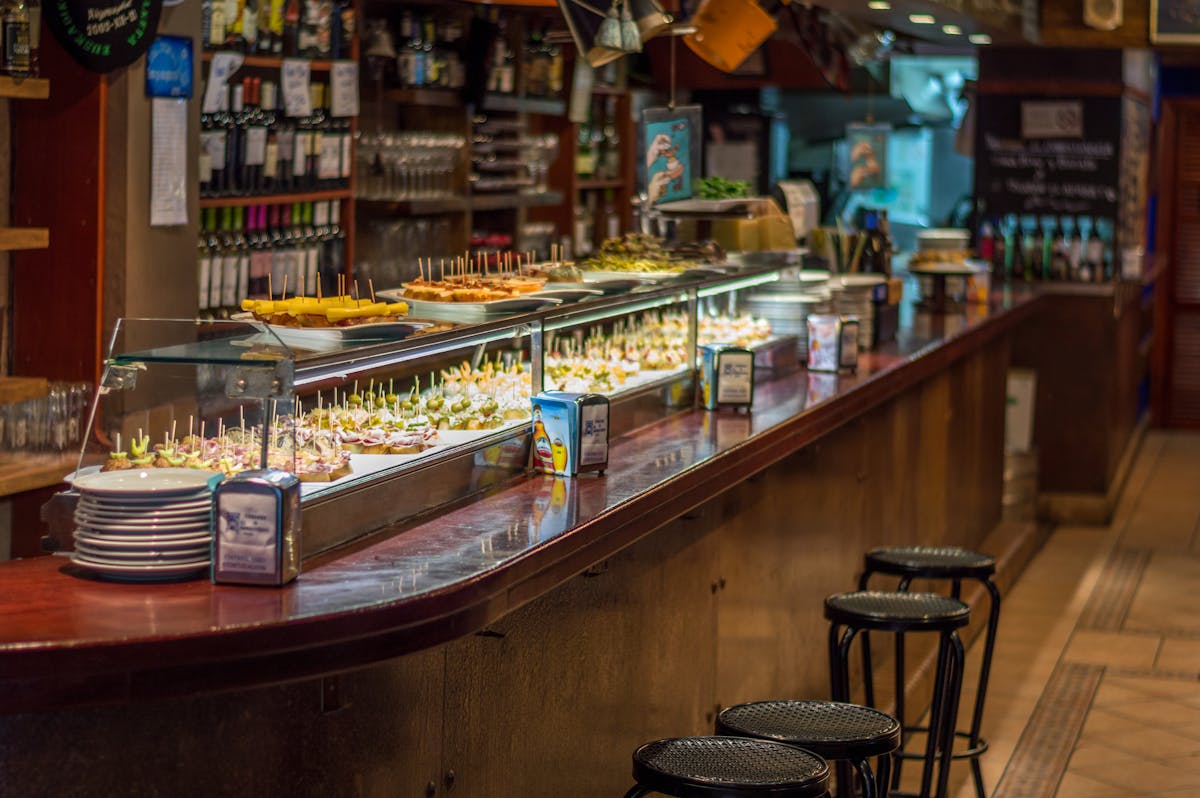 Pinchos and tapas lined up on a Barcelona bar counter