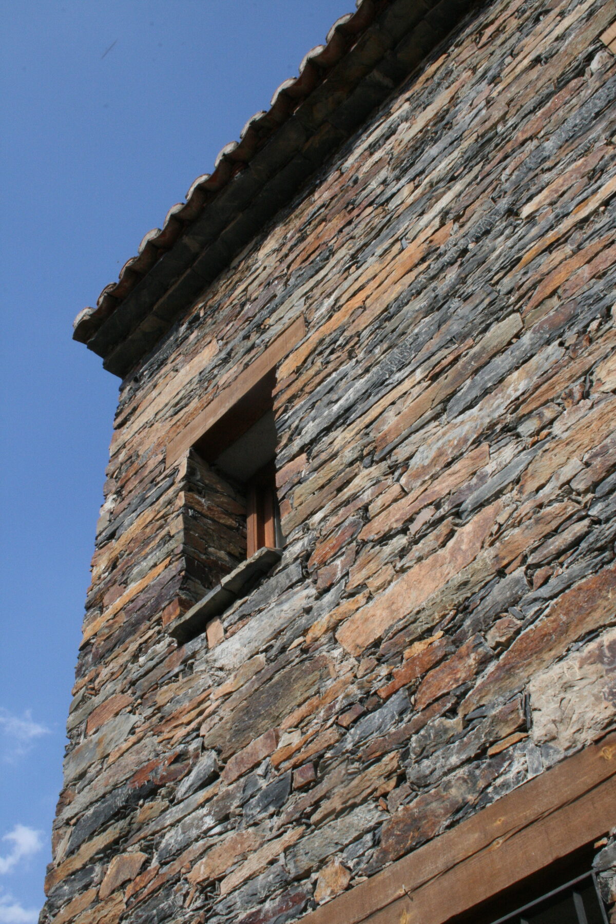 Dark slate buildings in the tiny mountain village of Patones de Arriba