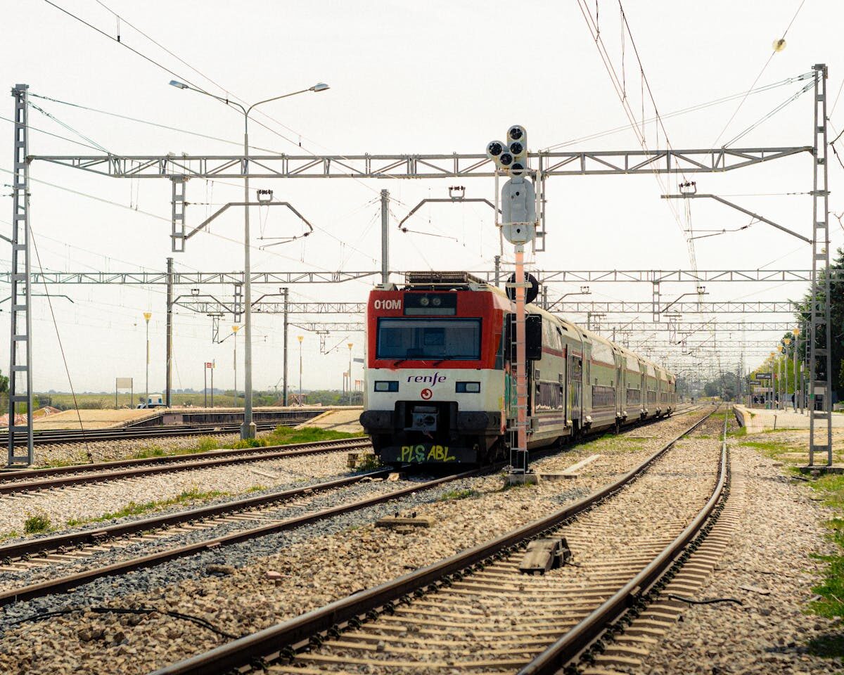 A Renfe train on tracks outside Madrid ready for a day trip