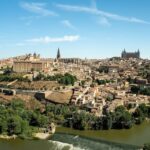 Panoramic view of Toledo Spain rising above the Tagus River with the cathedral and Alcazar visible