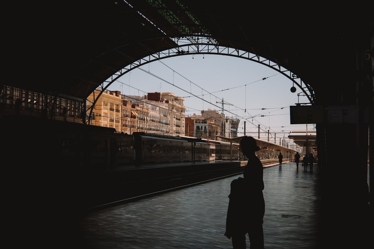 Silhouettes of travelers at Valencia railway station