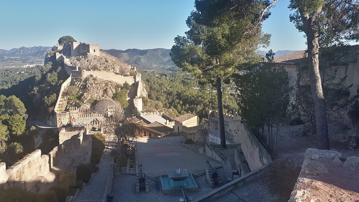 Castell de Xativa sprawling across twin hilltops above the valley