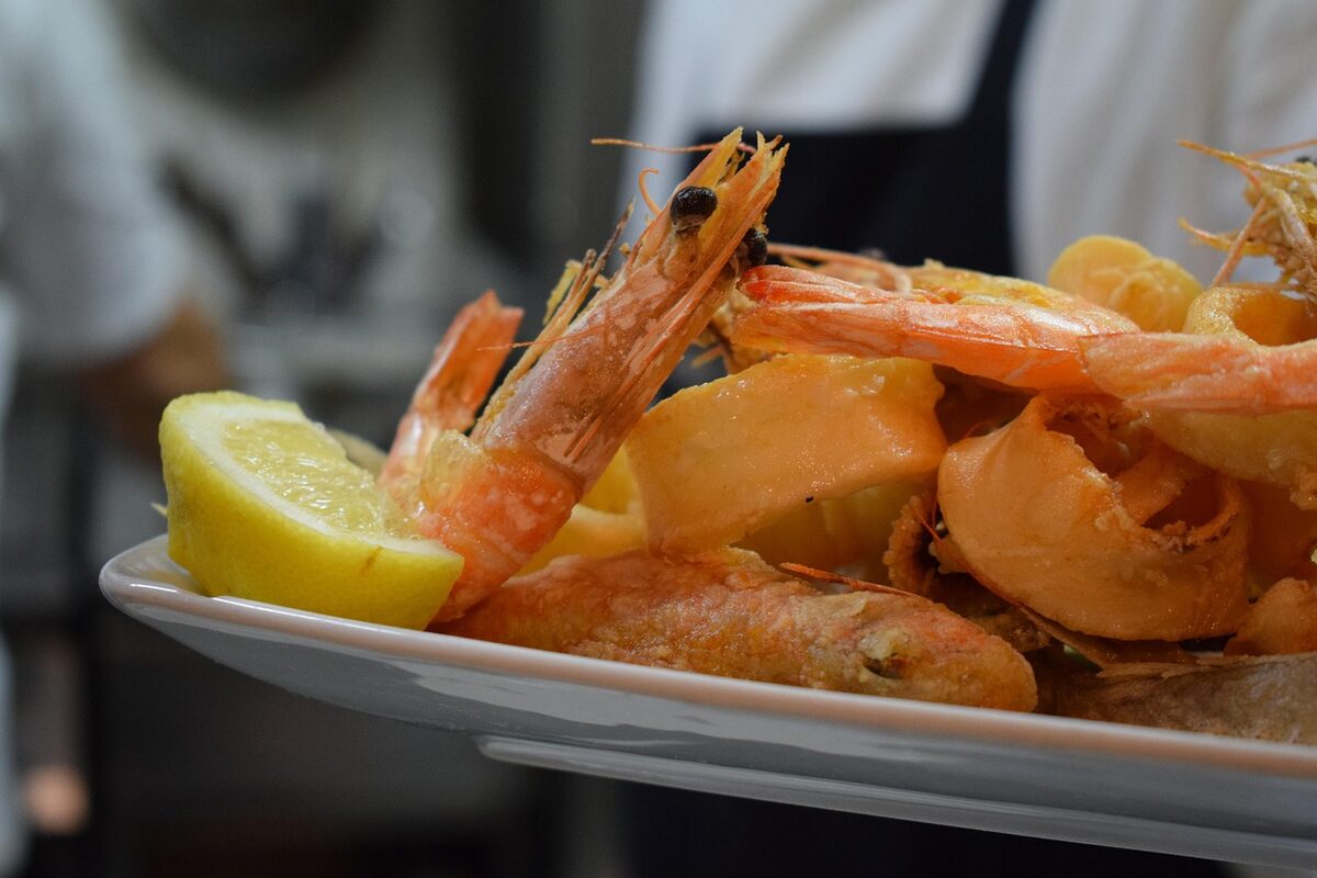 Plate of fried calamari with lemon, a Madrid street food staple