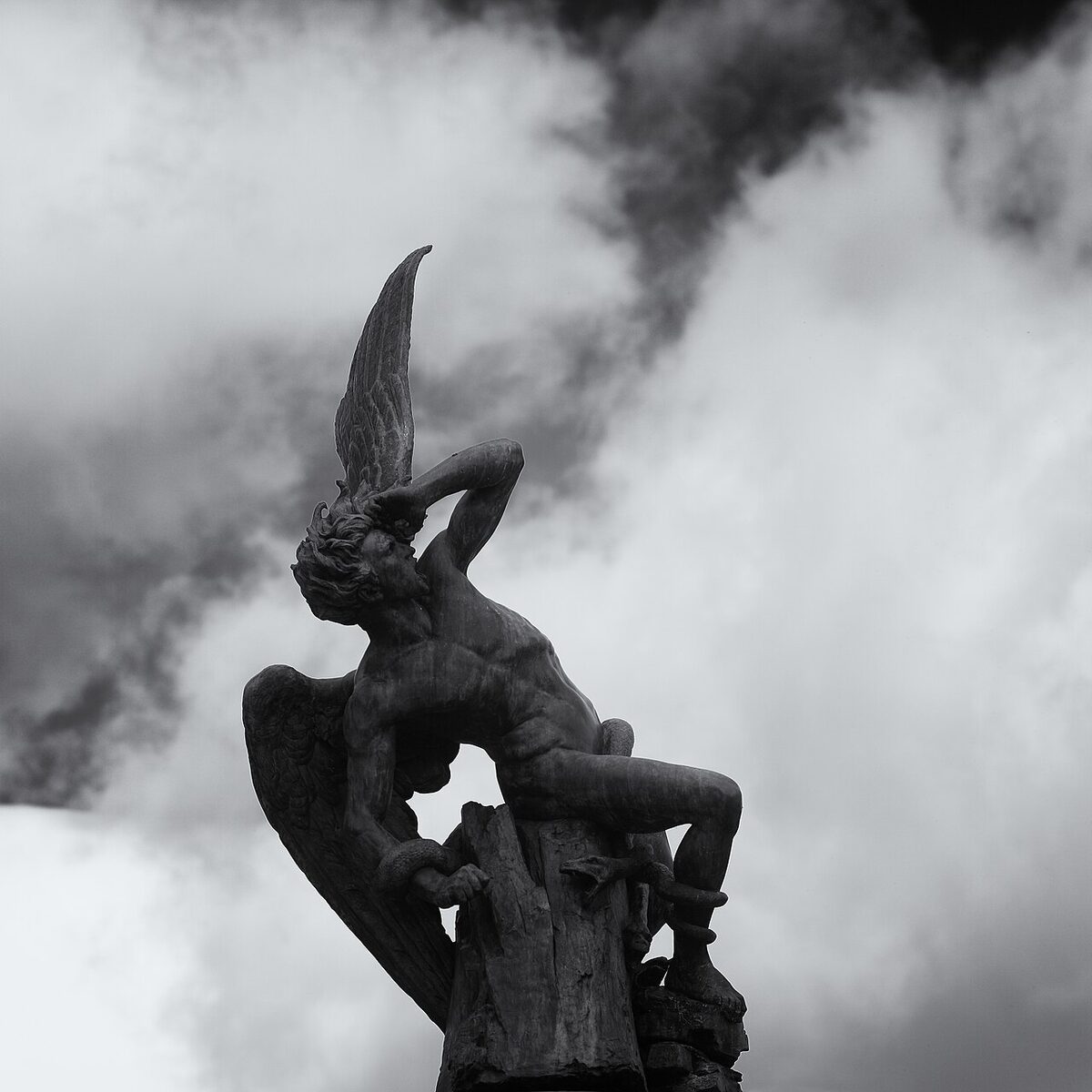 The Fallen Angel fountain statue in Retiro Park Madrid