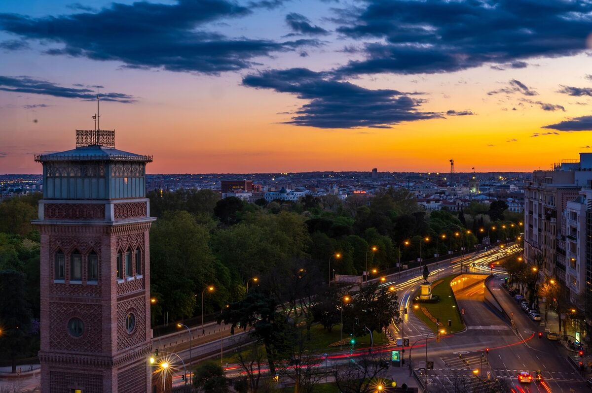 Madrid cityscape at sunset with clouds and monument