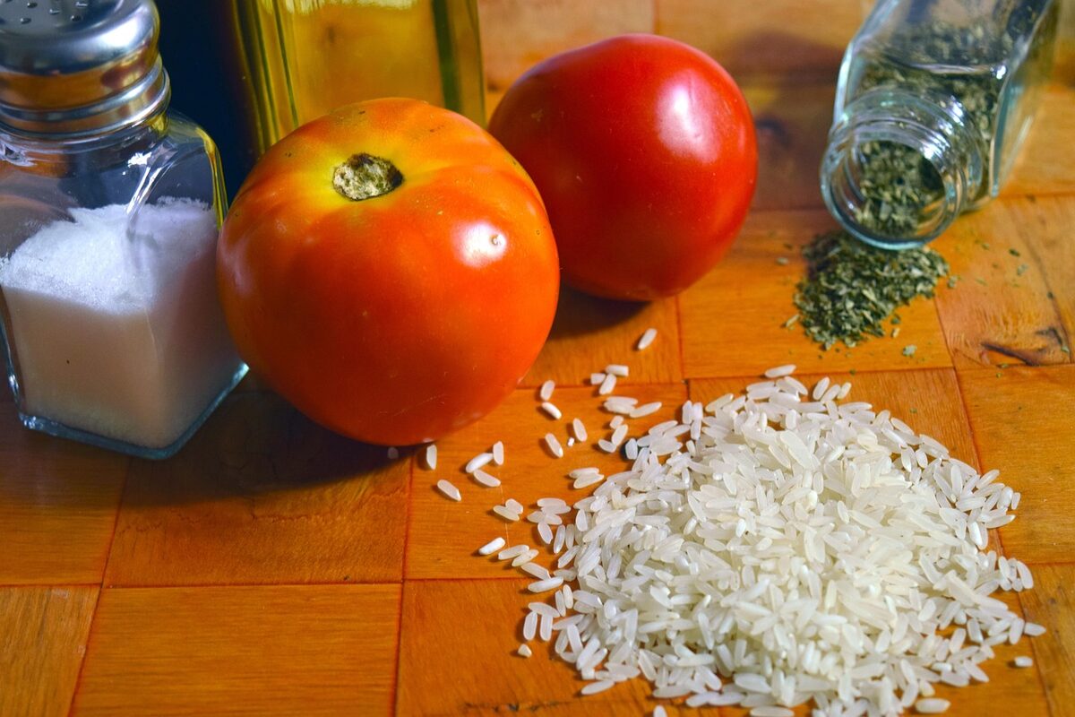 Rice, tomato, and other traditional Spanish ingredients for paella