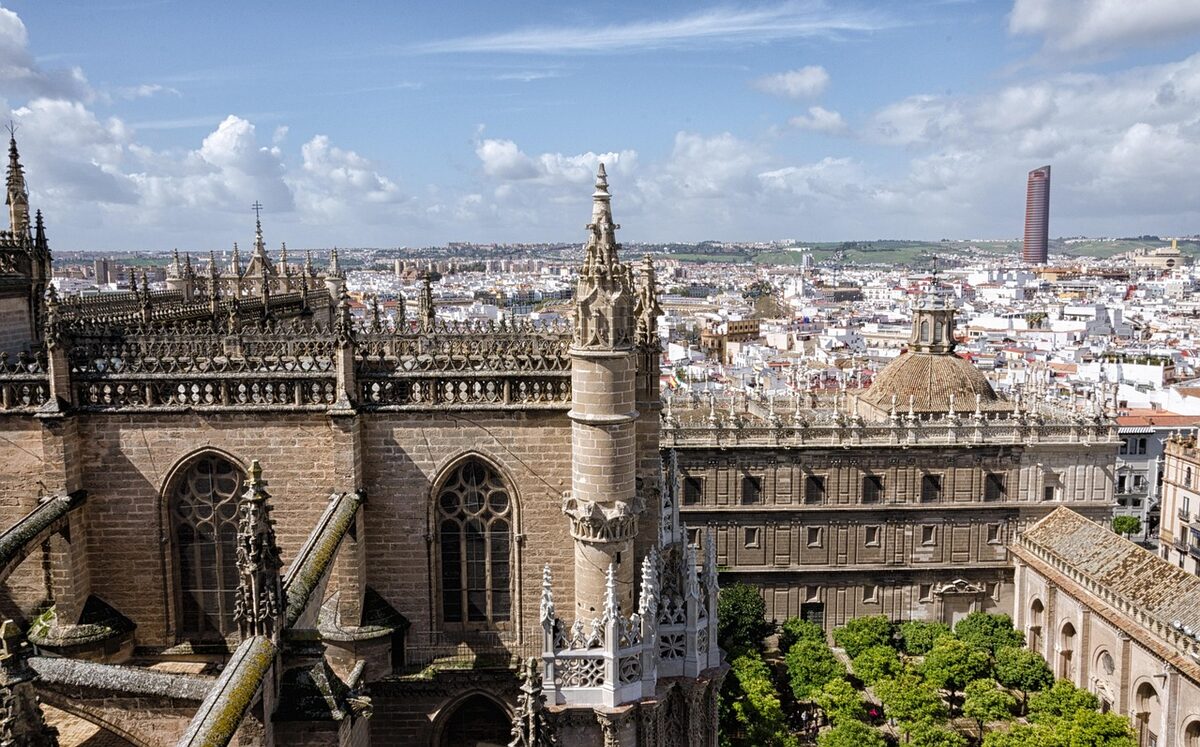 Seville Cathedral and Giralda tower rising above the city skyline