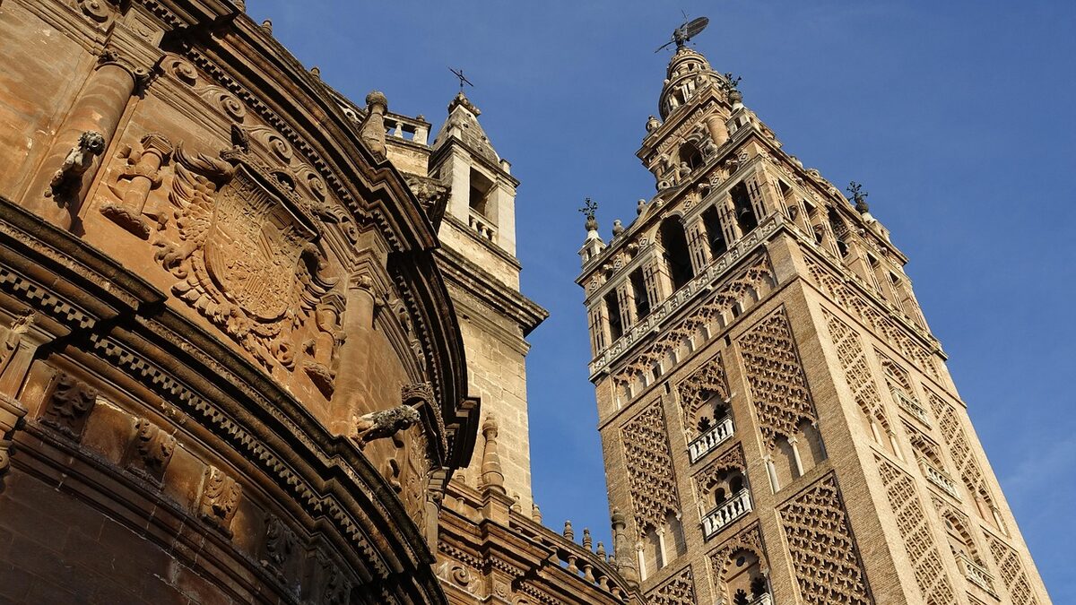 Close-up view of the Giralda bell tower with ornate Moorish and Renaissance details