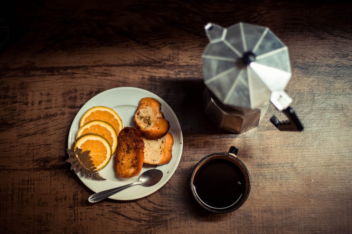 Overhead view of a Spanish breakfast spread with coffee and toast