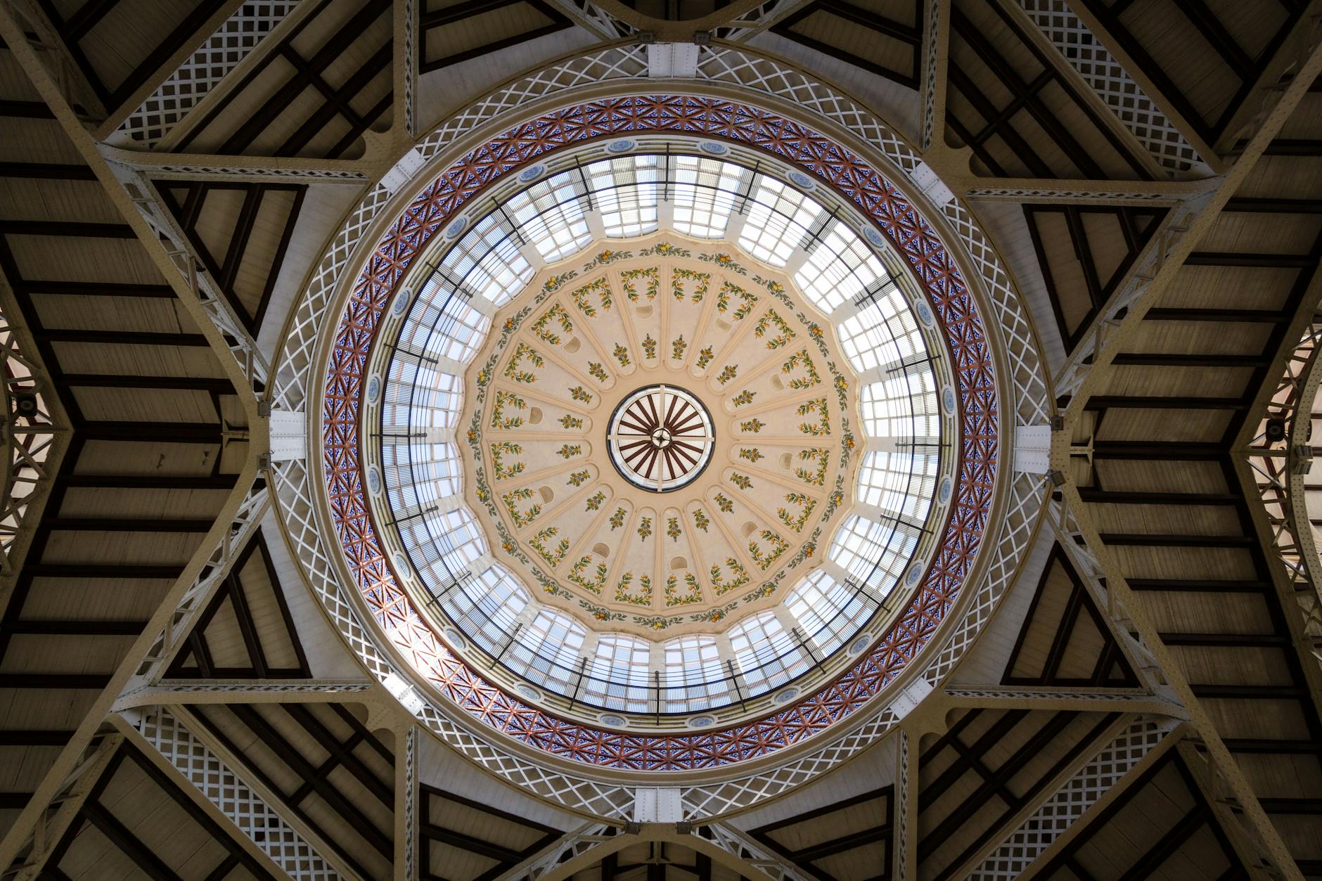 Colorful geometric stained glass dome ceiling inside Mercado Central Valencia