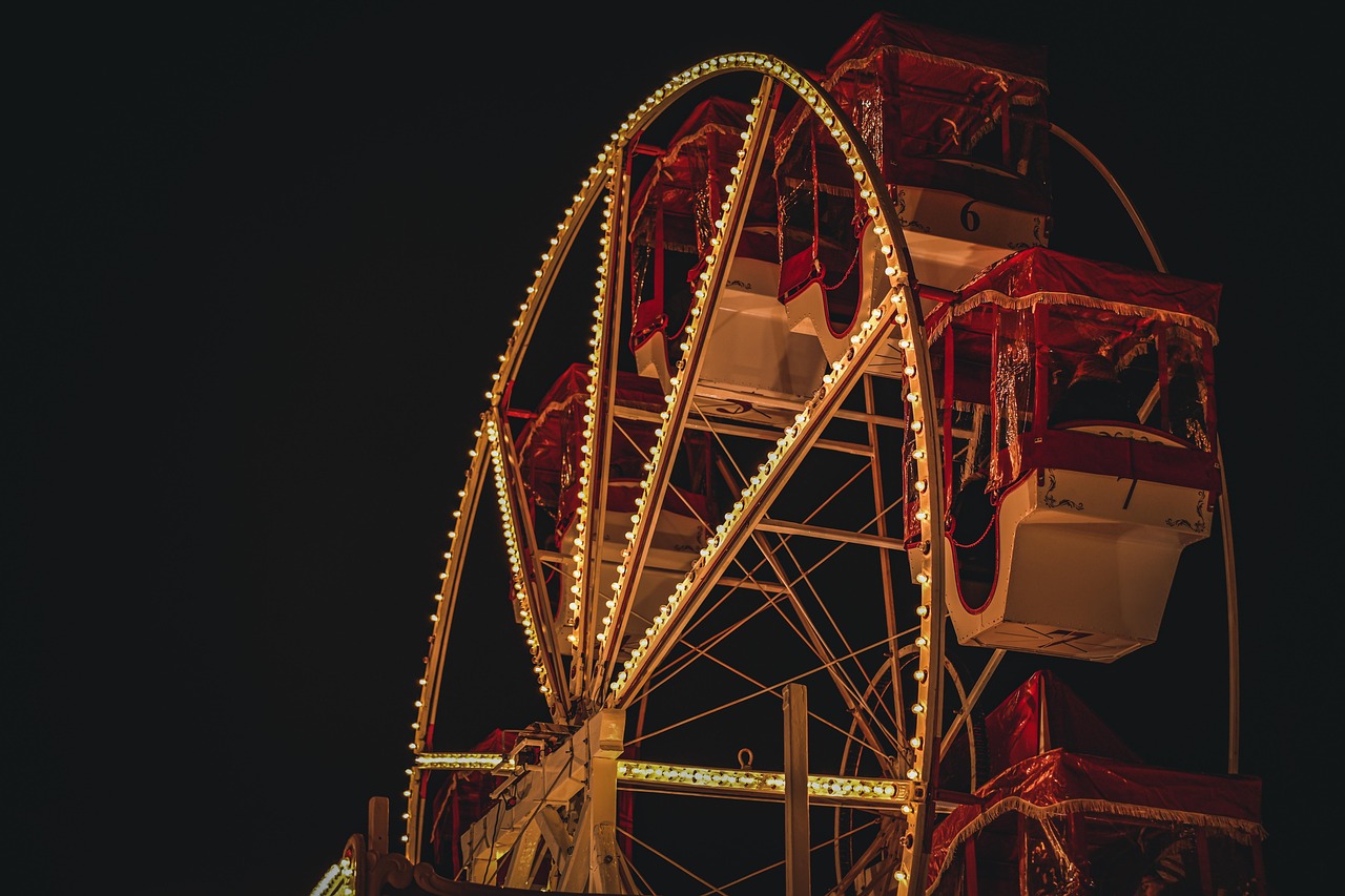 Illuminated Christmas market ferris wheel at night
