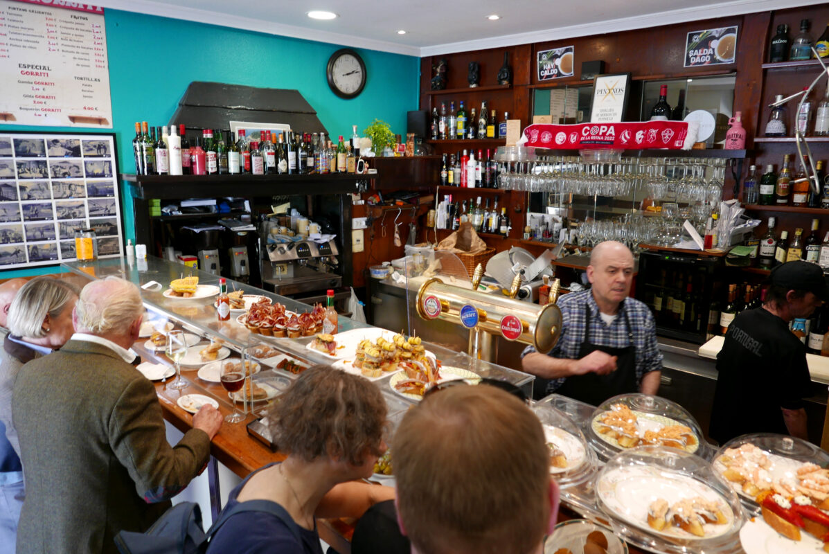 Pintxos displayed on a bar counter in San Sebastián