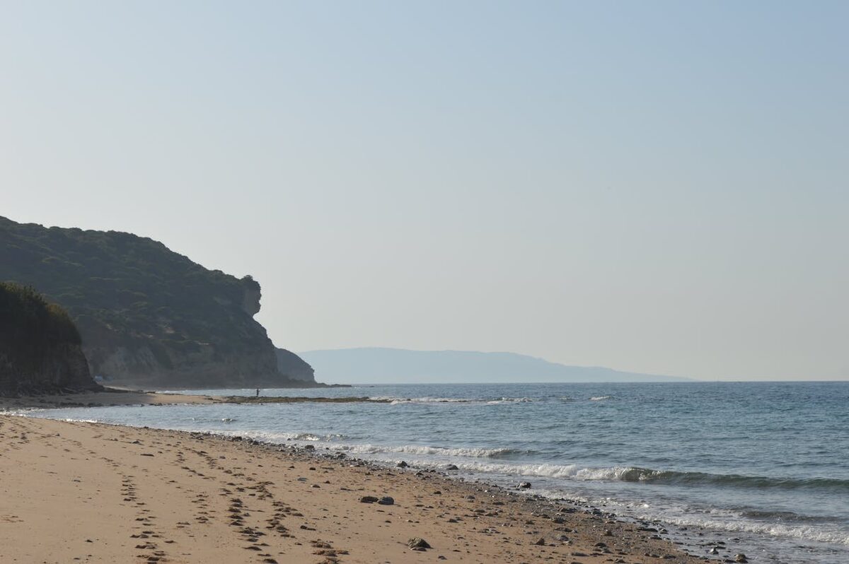 Peaceful waves meeting sandy shoreline at a quiet Mediterranean beach in Spain