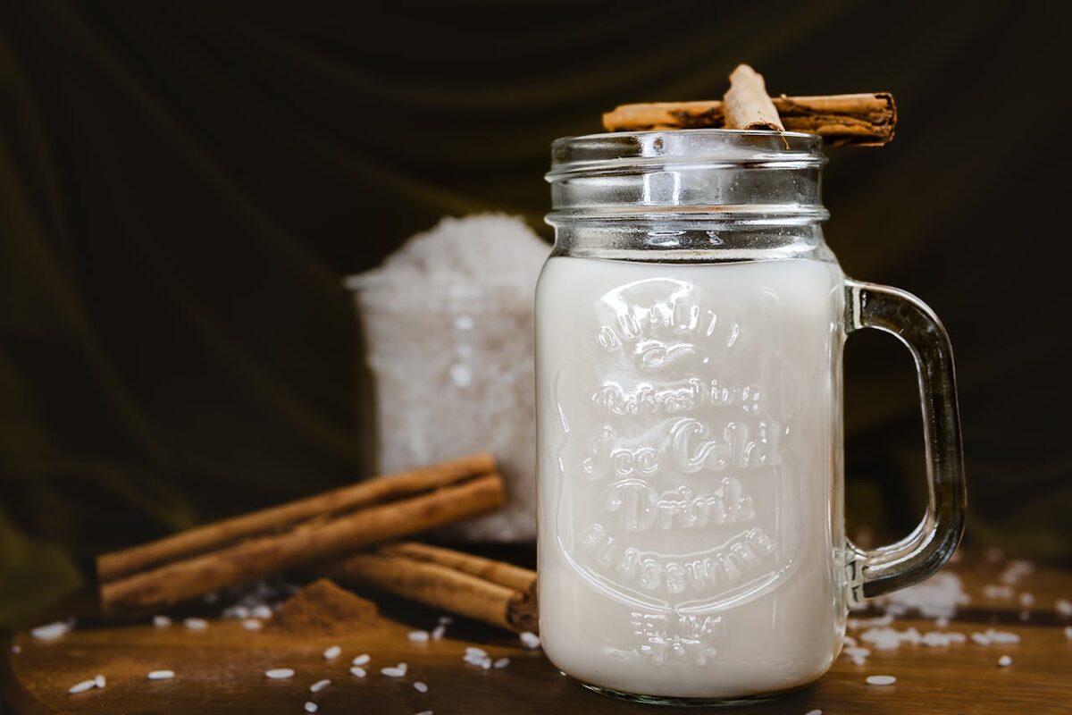 Refreshing traditional horchata served in a mason jar with cinnamon sticks