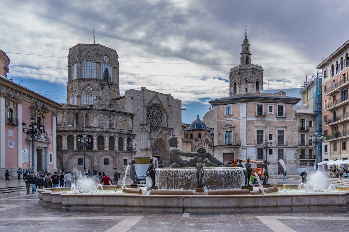 Plaza de la Virgen with Valencia Cathedral and fountain showcasing architectural beauty