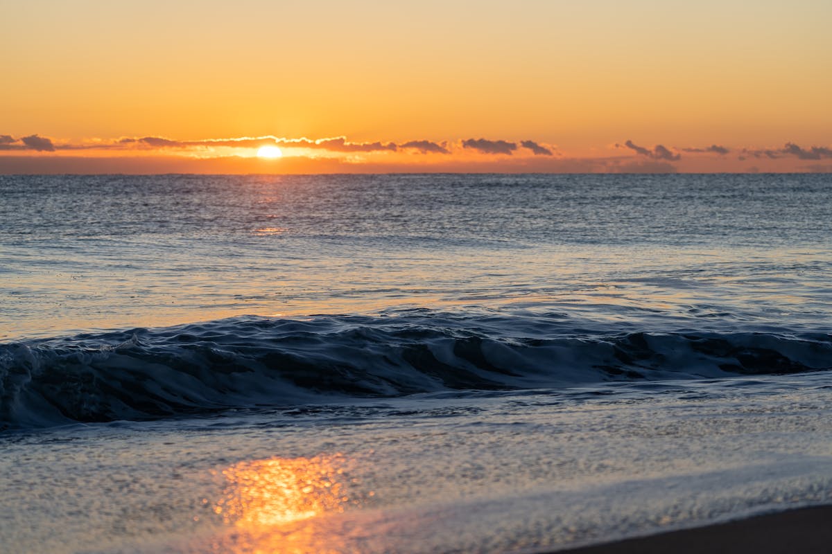 Sunset over the Mediterranean Sea at Valencia beach with gentle waves