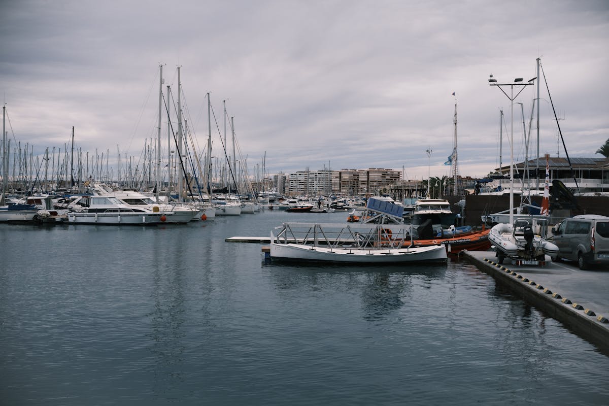 Sailing boats docked at the calm marina in Torrevieja near Valencia Spain
