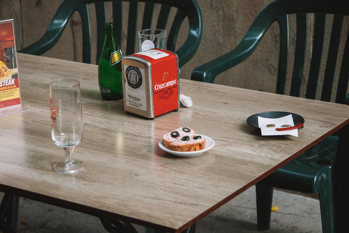 Casual outdoor cafe table with drinks in Valencia Spain