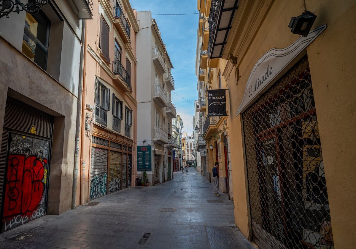 Narrow alleyway in Valencia historic quarter with street art
