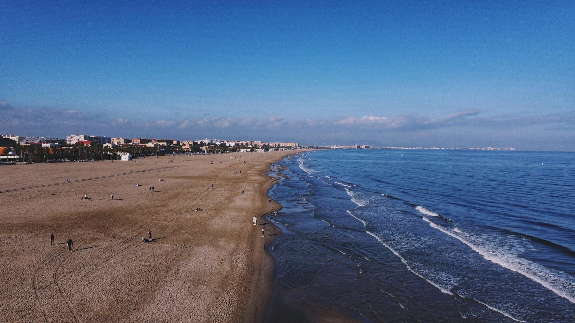 Stunning aerial view of Valencia coastline with Malvarrosa Beach and city buildings