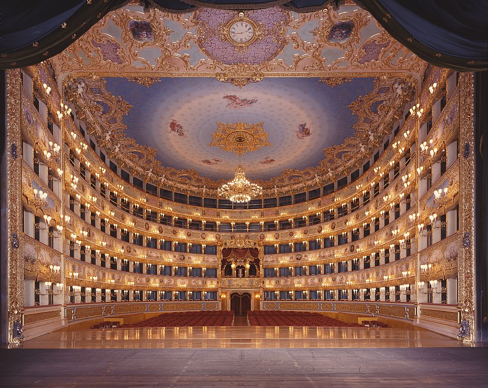 View of the Teatro La Fenice auditorium from the stage showing five tiers of gilded box seats