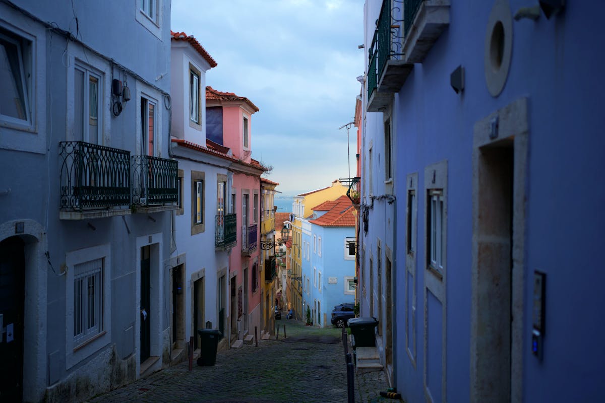 Colorful buildings lining a narrow street in Lisbon