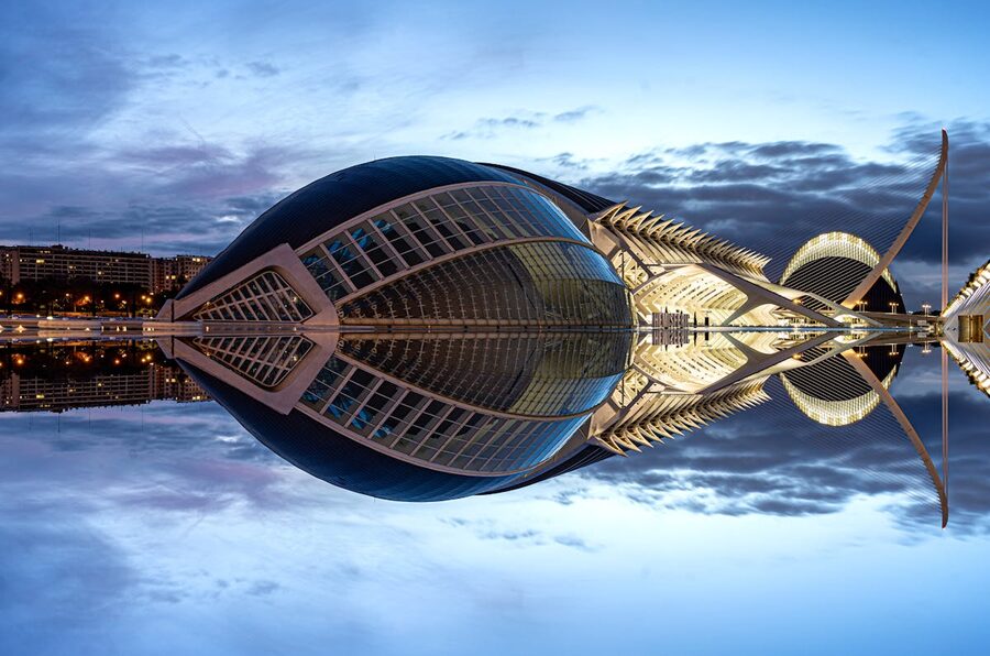 Twilight view of Valencia City of Arts and Sciences with buildings reflected in water