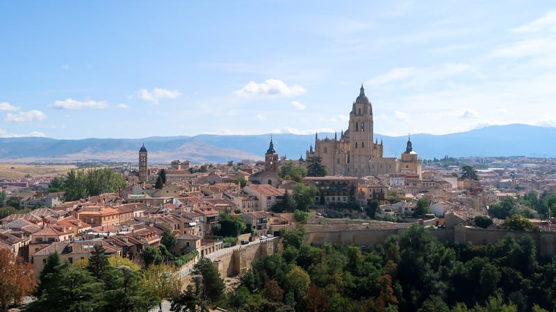 Aerial view of Segovia showing the cathedral and densely packed medieval buildings