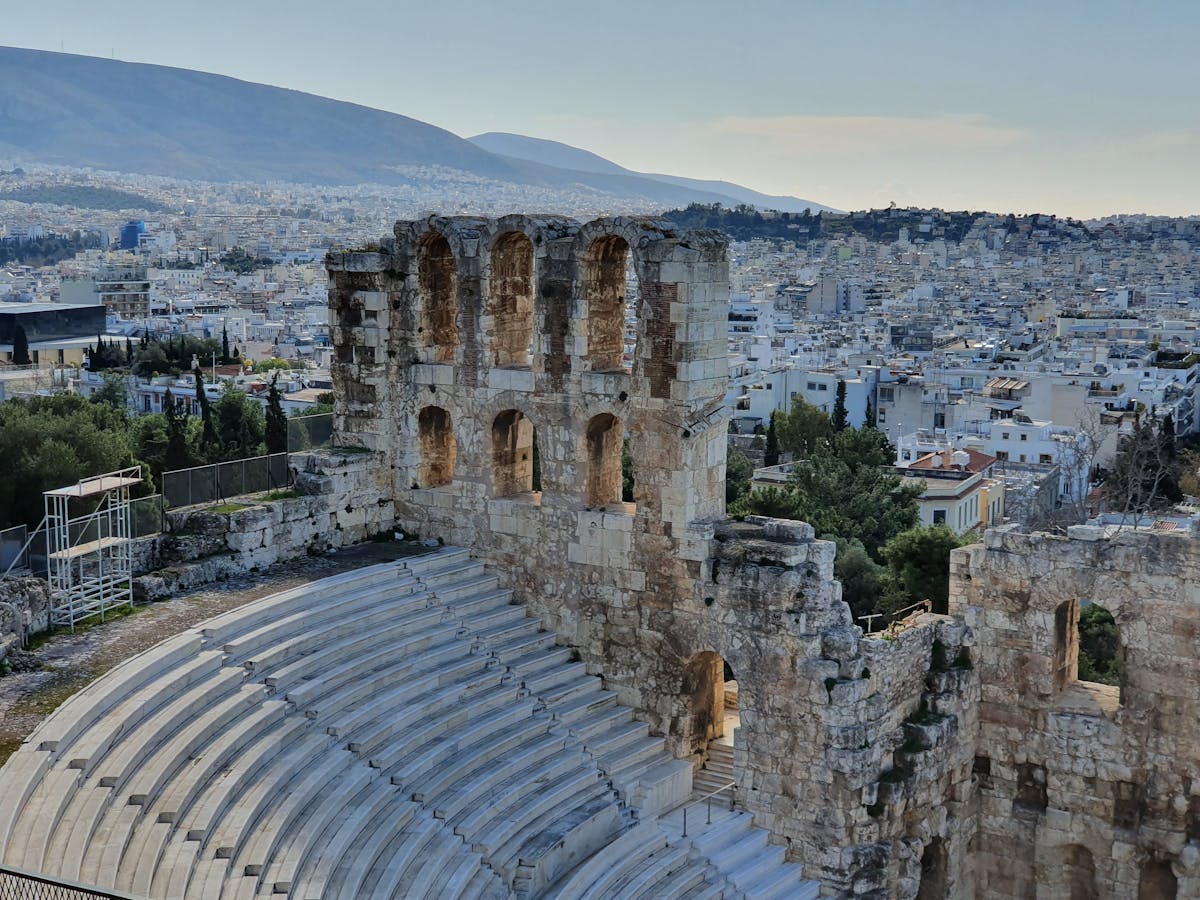 The Odeon of Herodes Atticus amphitheater with Athens buildings in the background