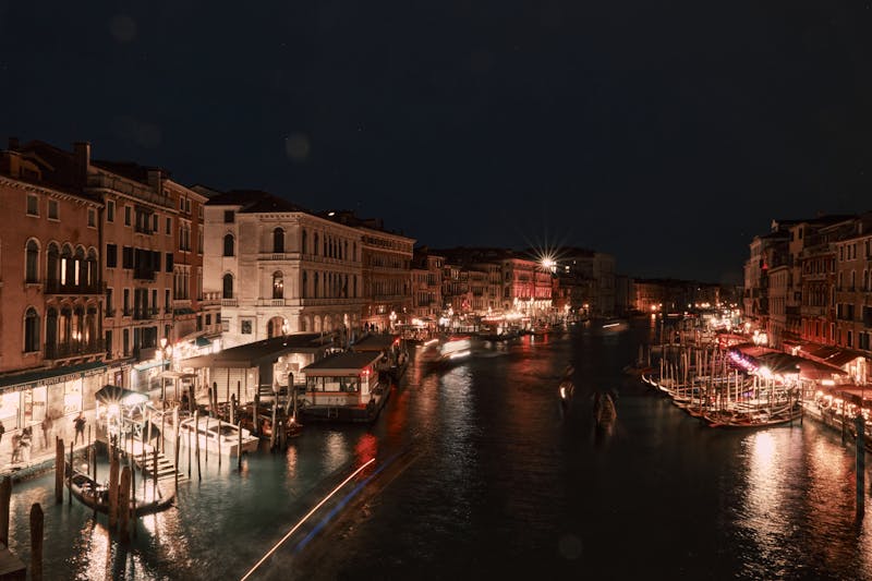 Stunning nighttime view of Venice Grand Canal with city lights reflecting on the water