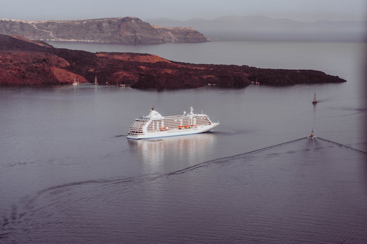 Ship near volcanic coast Santorini