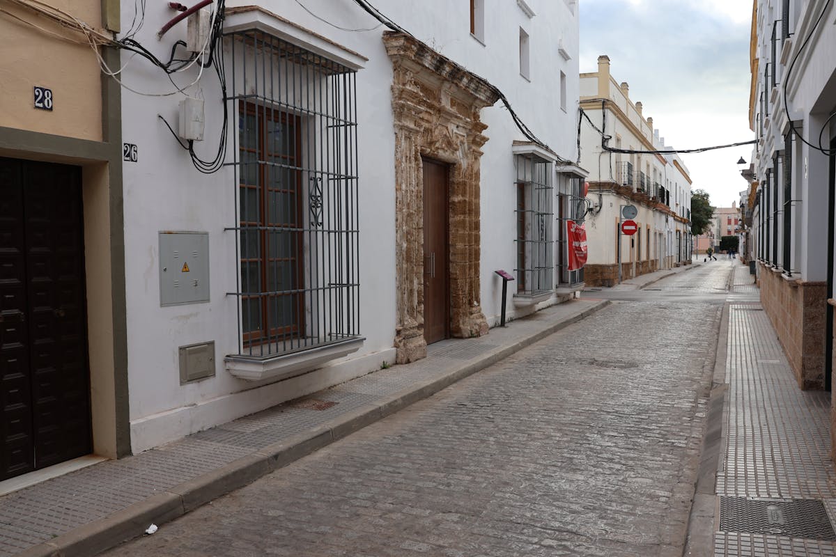 Quiet street with traditional white buildings in Andalusia