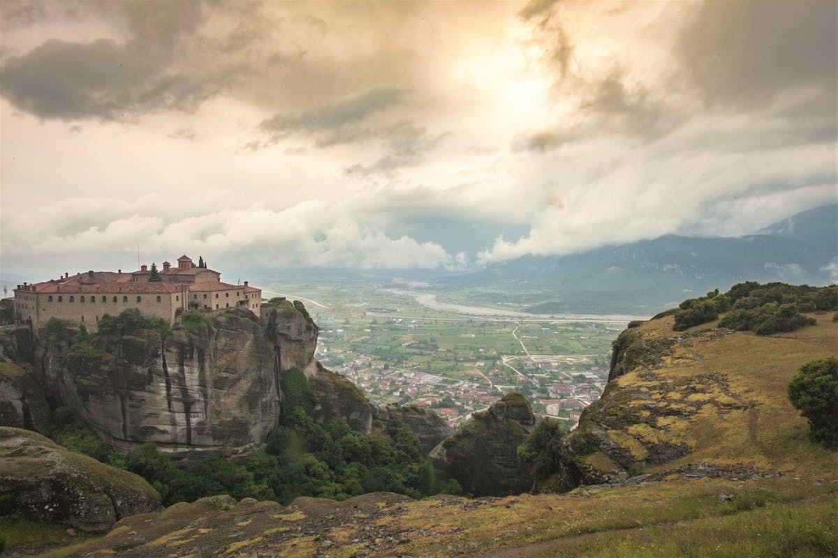 Meteora monastery with dramatic overcast sky