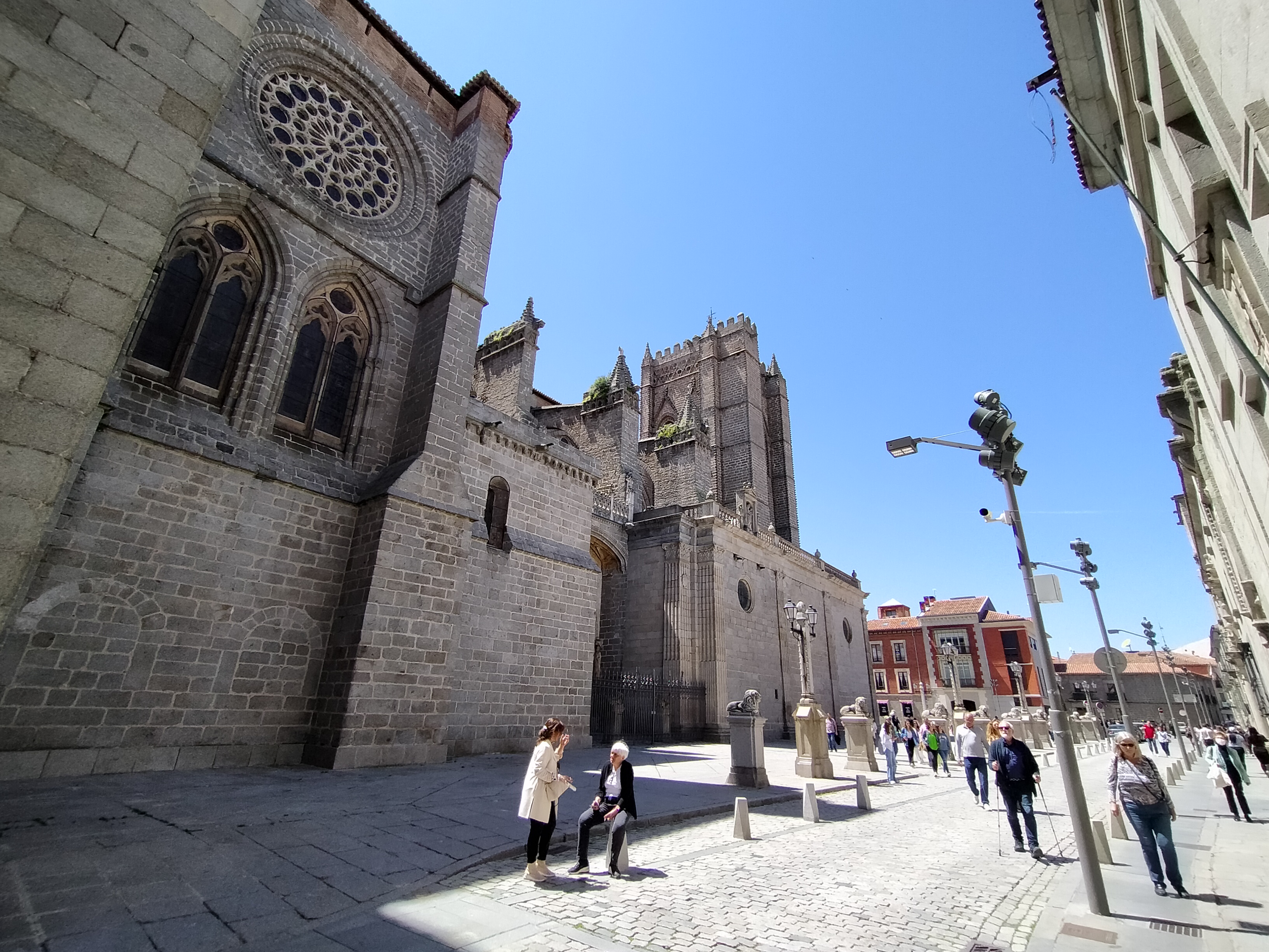 The Cathedral of Avila with its fortress-like granite exterior and Gothic rose window