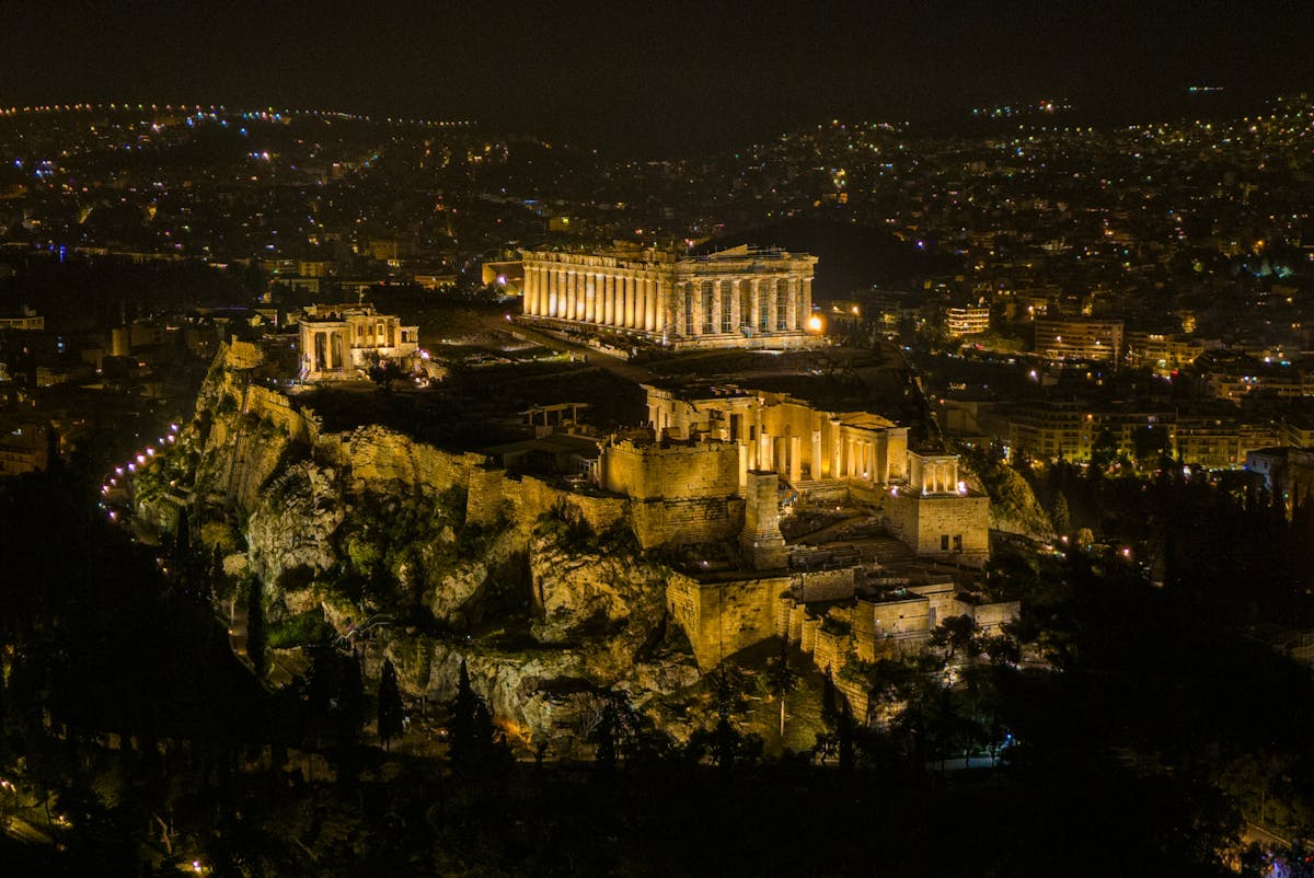 The Acropolis of Athens lit up at night seen from above