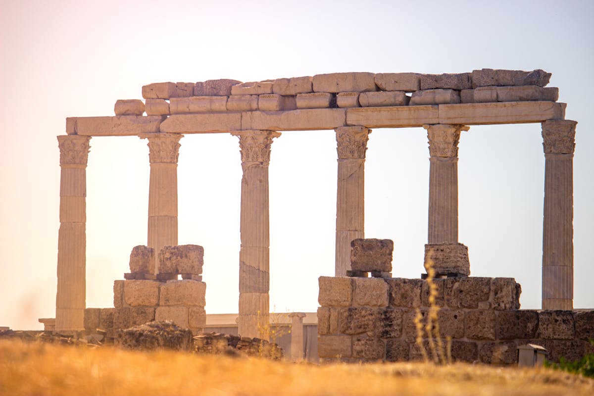 Ancient Greek columns and ruins captured at sunset