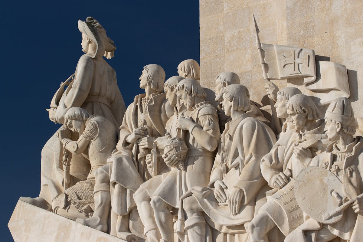 Close-up of explorer figures carved into the Monument to the Discoveries in Lisbon