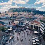 Aerial view of Monastiraki Square in Athens with crowds and the Acropolis