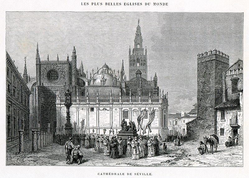 Wide view of Seville Cathedral exterior showing the massive Gothic structure