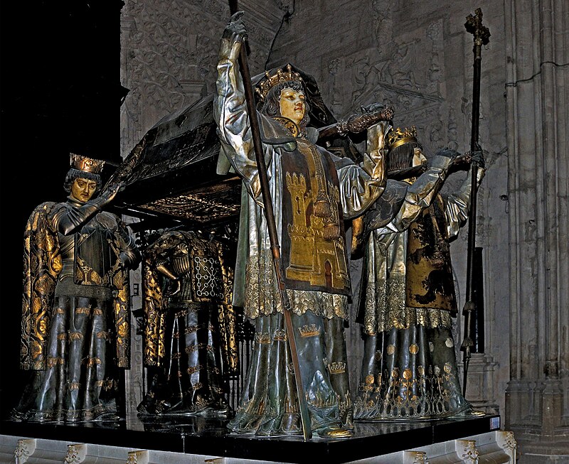 The ornate tomb of Christopher Columbus inside Seville Cathedral carried by four figures