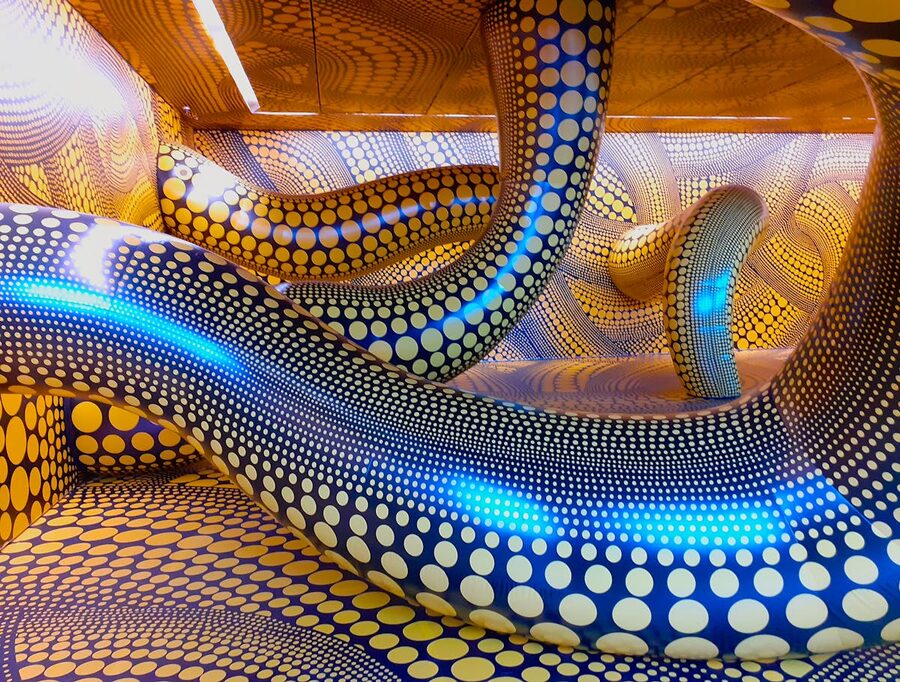 Colorful abstract installation featuring blue and yellow polka dot patterns