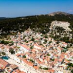 Aerial view of Hvar town showing coastline and historic architecture