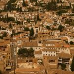 Aerial view of the Albaicin neighbourhood showing whitewashed houses and terracotta rooftops in Granada Spain