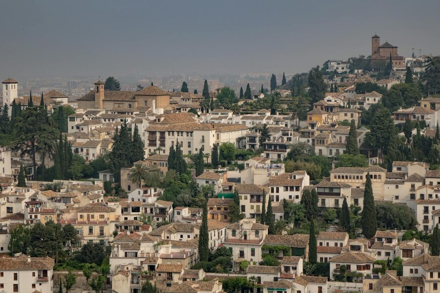 Panoramic view of the Albaicin neighbourhood in Granada with traditional houses and church towers