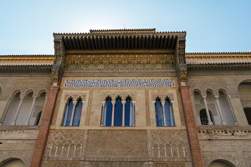 Detailed view of the ornate Moorish facade at the Alcazar of Seville