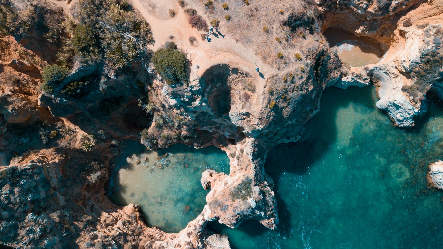 Stunning aerial of rocky Algarve coastline with turquoise water