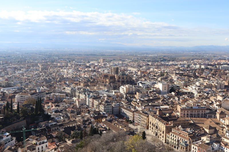 Aerial view of Granada cityscape with the Alhambra visible on the hilltop