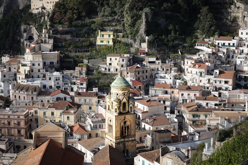 View of Amalfi Cathedral with its iconic striped facade and the town square